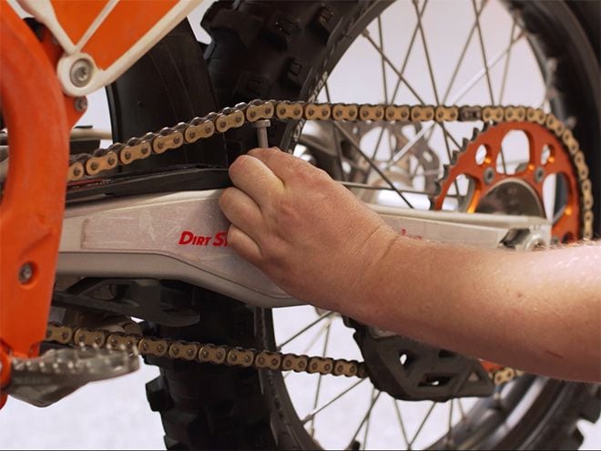 How To Adjust Chain On KTM Motorcycle | VIDEO | Dirt Rider